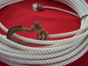 King rope with rawhide hondo with colored string